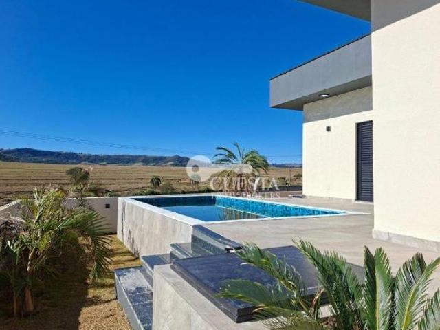 Casa com 3 dormitórios à venda, 181 m² por R$ 849.000,00 Condomínio Ninho Verde II Pardinho/SP