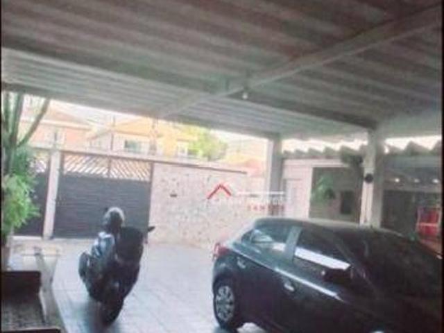 Casa com 3 dormitórios à venda, 212 m² por R$ 880.000,00 Estuário Santos/SP