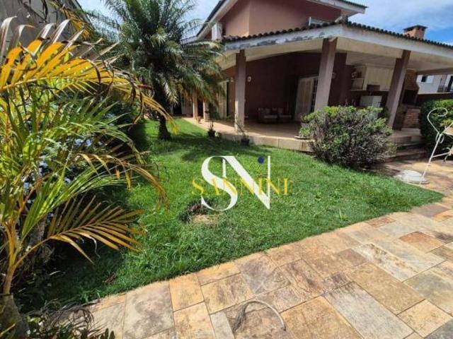 Casa com 3 dormitórios à venda, 461 m² por R$ 4.200.000,00 Residencial Melville Santana de Parna