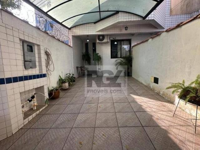 Casa com 3 dormitórios à venda, 97 m² por R$ 1.160.000,00 Aparecida Santos/SP