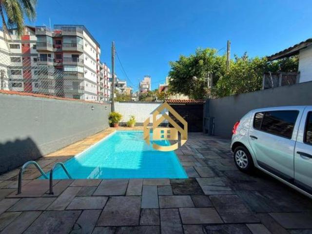 Casa com 3 dormitórios à venda por R$ 670.000 Praia da Enseada Guarujá/SP