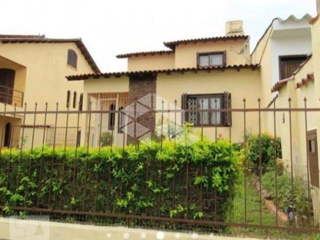 Casa com 3 dormitórios e salão de festas para venda no Partenon