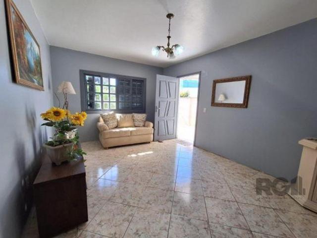 Casa com 3 dormitórios, suíte, lareira, Jardim Algarve em Alvorada RS