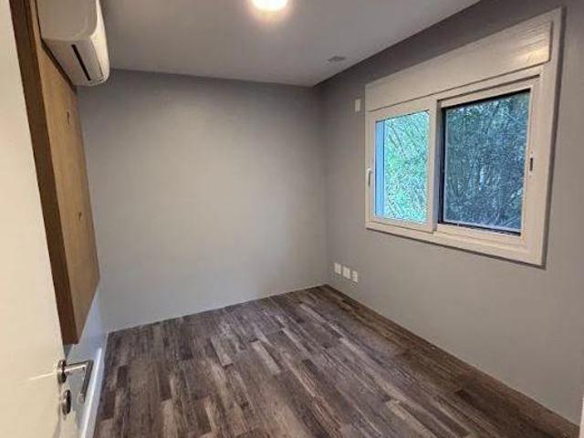 Casa com 3 dormitórios suítes no bairro Vila nova em Porto Alegre/RS