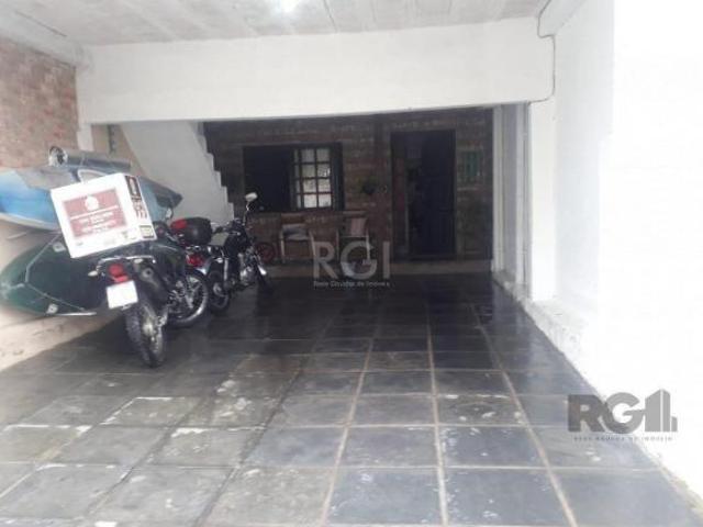 Casa com 3 dormitórios, sendo 1 suíte no bairro Hípica