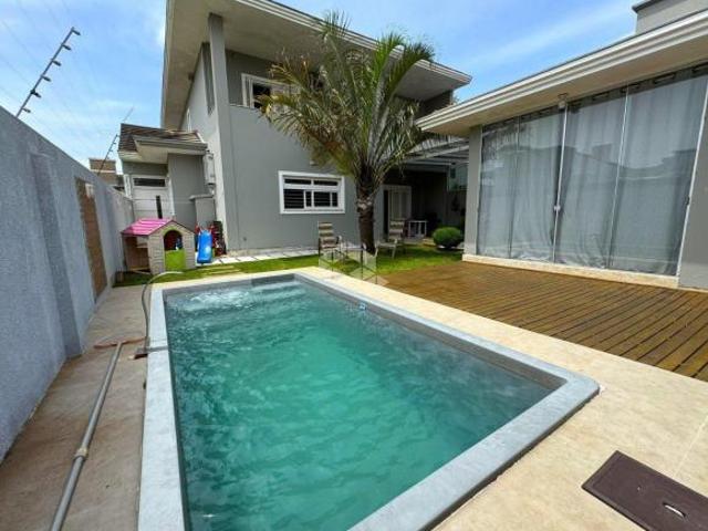 Casa com 3 dormitórios, sendo 3 suítes, 4 vagas, no Bairro Marechal Rondon em Canoas RS