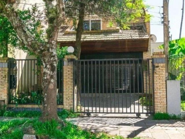 Casa com 3 quartos, 1 suíte, 2 vagas, e 234m² à venda no bairro Tristeza