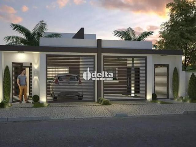 Casa com 3 quartos, sendo 1 suíte, disponível para venda no bairro Novo Mundo, em Uberlândia?MG