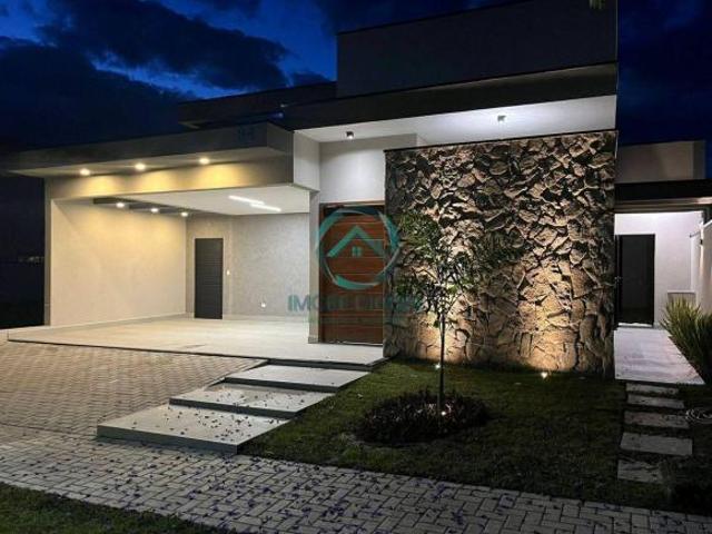 CASA COM TRÊS DORMITÓRIOS SENDO TRÊS SUITES LOCALIZADA NO CONDOMINIO OUROVILLE