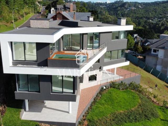 CASA COM UMA EXUBERANTE VISTA NO CONDOMÍNIO ALPHAVILLE