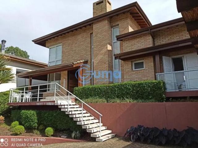 Casa com estilo colonial, 4 dormitórios e piscina, à venda, 318 m² por R$ 3.200.000,00 Condomíni
