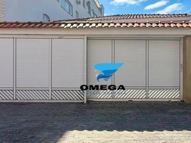Casa com lazer à venda praia da Enseada no Guarujá I Omega Imoveis