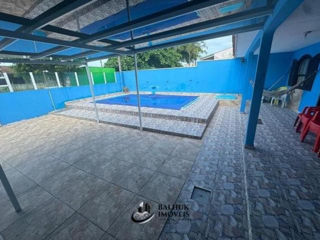 Casa com piscina na praia