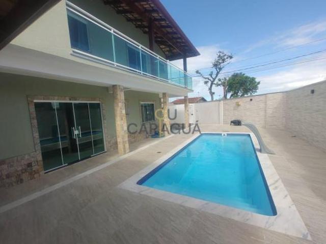 Casa com piscina e 03 dormitórios, sendo 02 suítes em Caraguatatuba