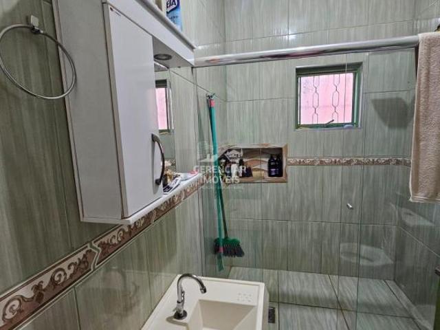 Casa com quintal e garagem a venda em Igarapé MG