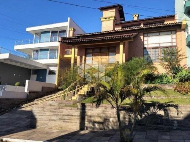 Casa Condomínio Fechado 3 dormitórios no bairro Nonoai em Poa/RS