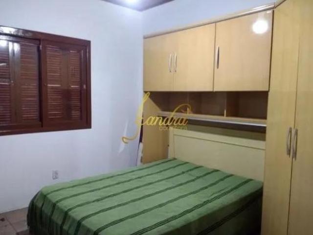 Casa duas quadras do mar venda ou locação de temporada com 03 dormitórios