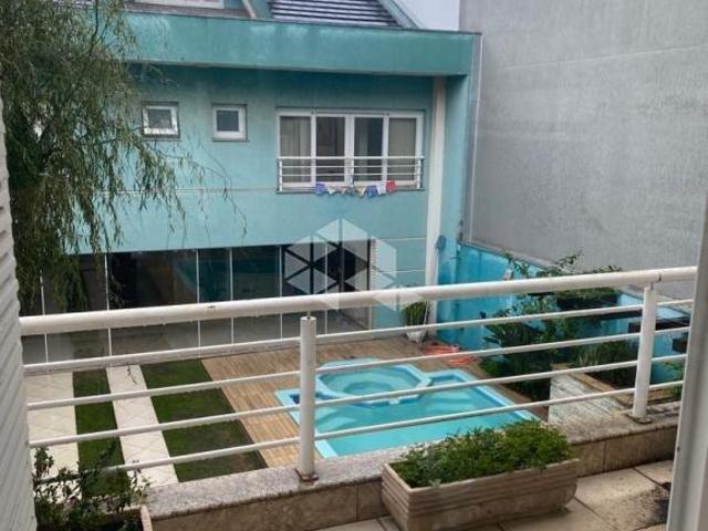 Casa de Alto Padrão no Centro de Esteio | 692 m² de Elegância e Sofisticação