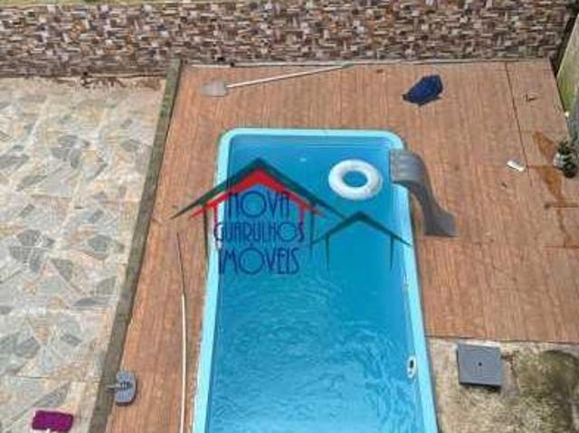 Casa de Alto Padrão com Piscina e 4 Suítes à Venda | Garagem para 10 Carros