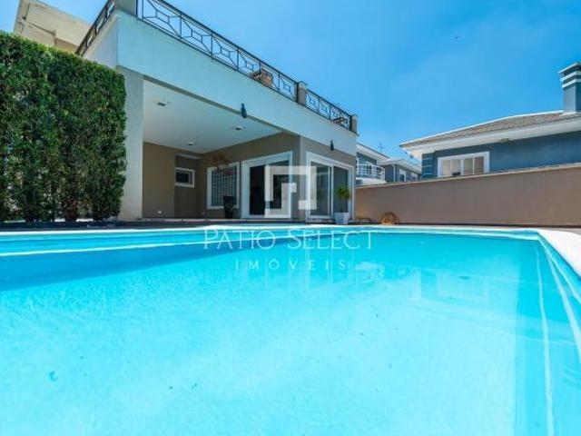 Casa de condomínio com 305 m², 4 quartos sendo 4 suítes à venda no bairro Umbará