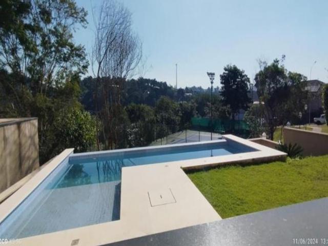 Casa de Condomínio com 4 Quartos e 6 banheiros à Venda, 504 m²