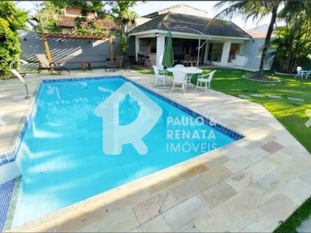 Casa de Condomínio com 6 Quartos e 8 banheiros à Venda, 661 m² por R$ 7.000.000