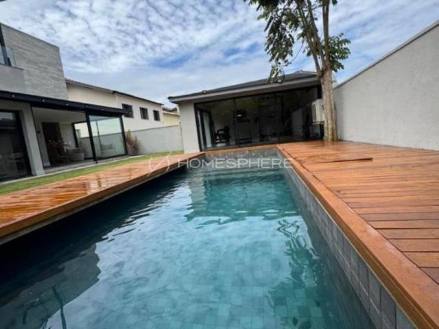 Casa de condomínio ALPHAVILLE 2 com 420 m², 5 suítes