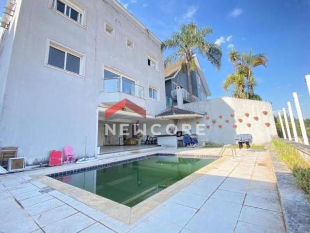 Casa de condomínio em Alameda Miruna Alphaville Santana de Parnaíba/SP