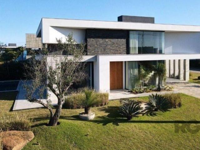 Casa de Condomínio em Atlântida Sul
