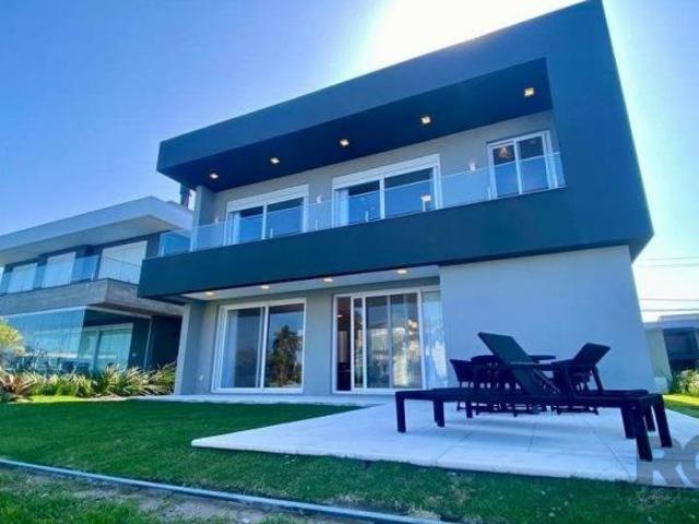 Casa de Condomínio em Atlântida Sul