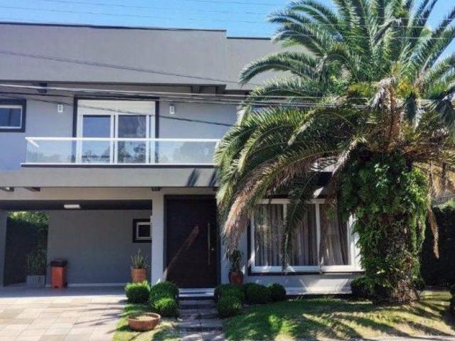 Casa de Condomínio em Atlântida Sul