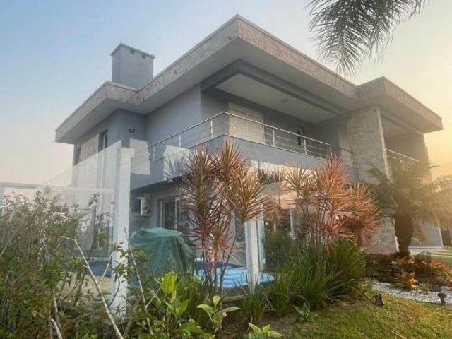 Casa de Condomínio em Atlântida Sul