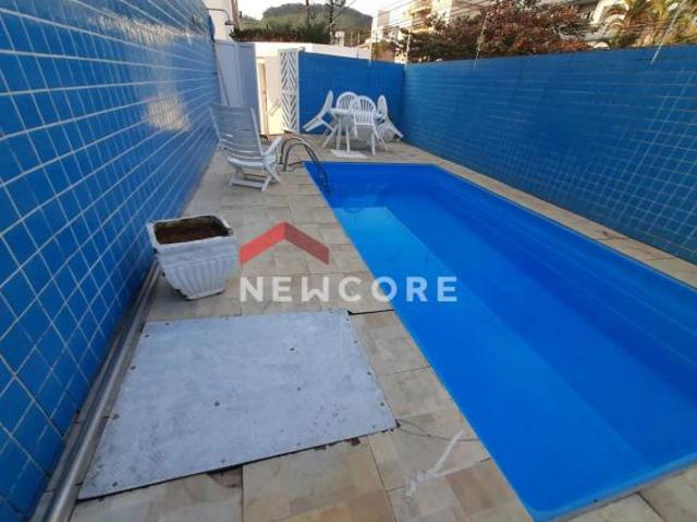 Casa de condomínio em Avenida dos Caiçaras Jardim Las Palmas Guarujá/SP