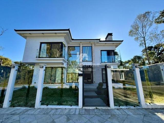 CASA DE PORTEIRA FECHADA EM LOTEAMENTO DE GRAMADO