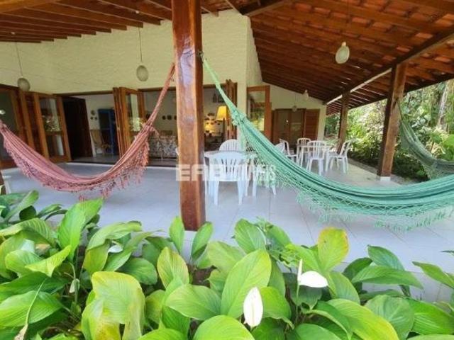 Casa de praia com 3 dormitórios, térrea e em frente à área verde