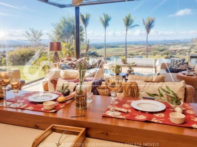 Casa de revista com vista livre para o lago e campo de golfe, disponível para venda na Fazenda da Gr