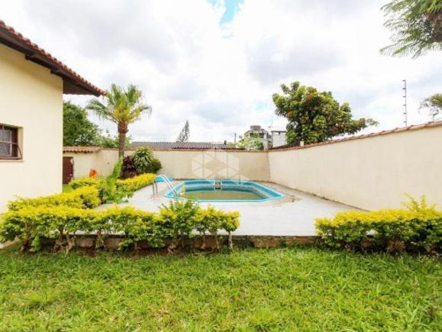 Casa de 03 dormitórios, suíte e 205m² no bairro Harmonia em Canoas