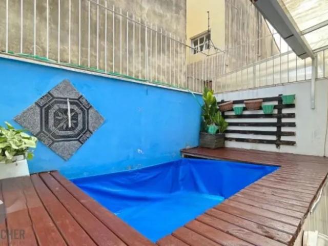 Casa de 2 dormitórios à venda Rua Heitor Kramer, Guarujá Porto Alegre
