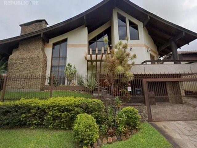 Casa de 3 dormitórios e 4 vagas de Garagem no Bairro Dom Feliciano em Gravataí