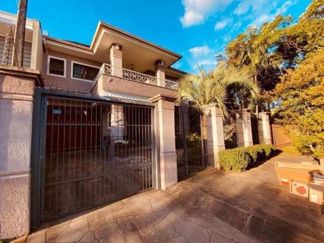 Casa de 3 dormitórios, elevador e 3 vagas de garagem em Canoas
