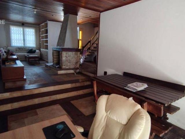 Casa de 3 dormitórios no bairro à venda em Vila Nova, Porto Alegre