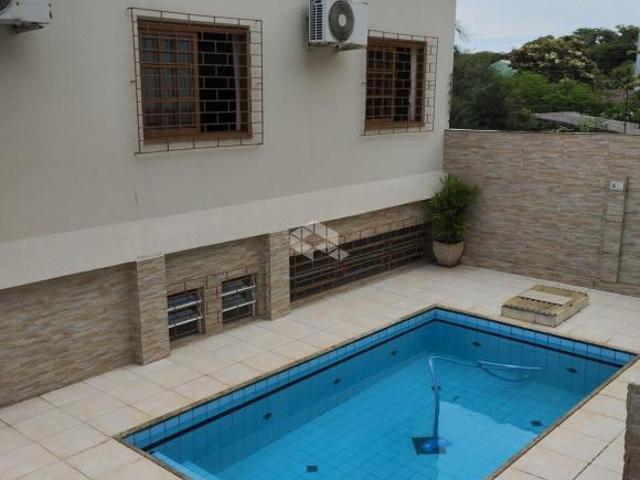 Casa de 3 dormitórios no bairro Glória