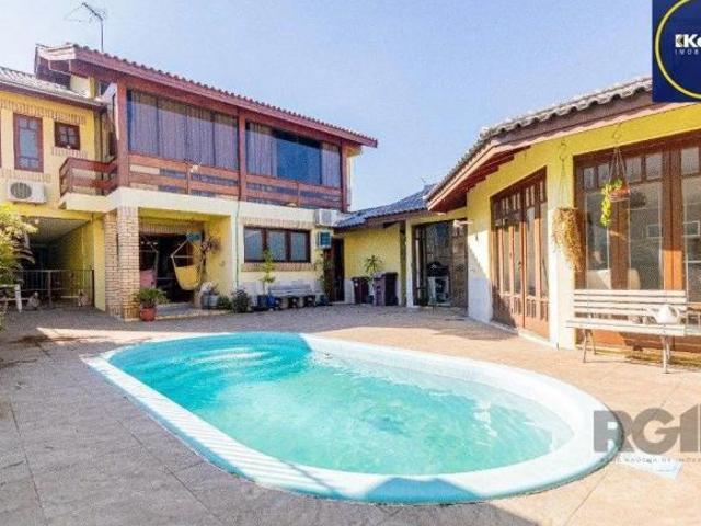 Casa de 4 dormitórios 304m² no bairro Jardim Lindóia