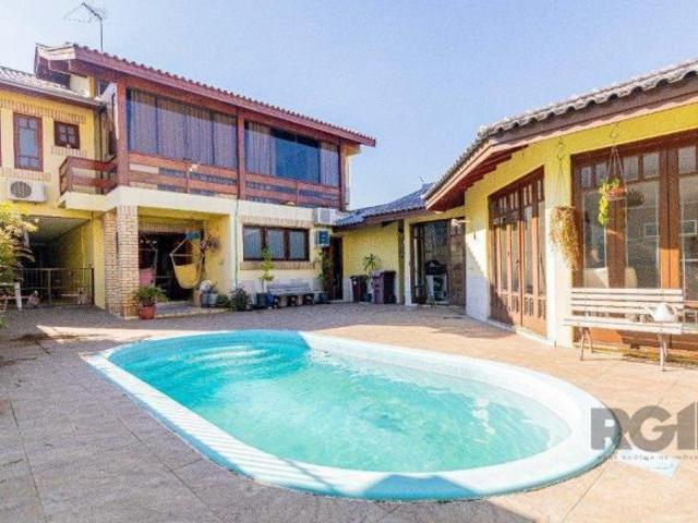 Casa de 4 dormitórios 304m² no bairro Jardim Lindóia