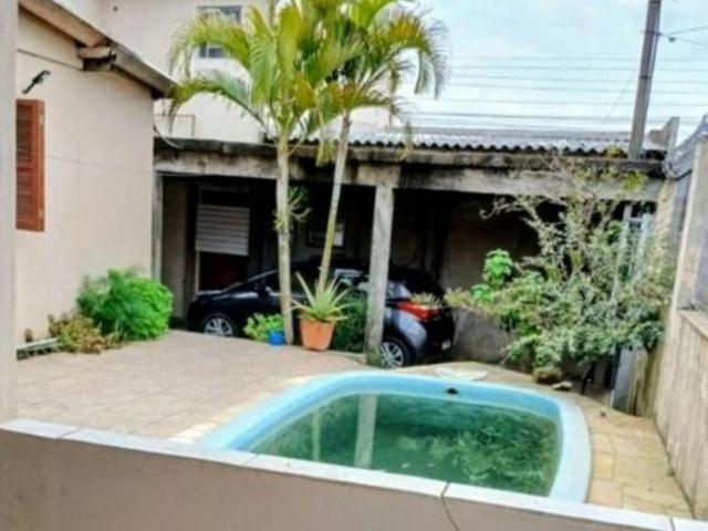 Casa de 4 Dormitórios e 2 vagas de Garagem em Gravataí