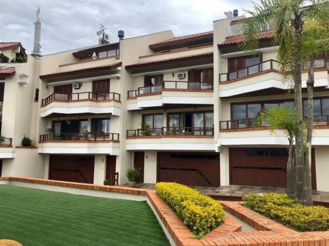 Casa em condomínio 3 dorms living com sacada 2 box