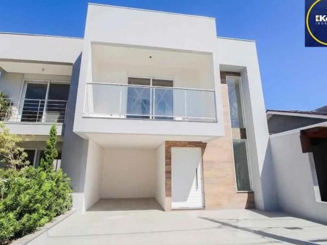 Casa em condomínio 4 D, sendo um dormitório no térreo, 168 m², garagem coberta