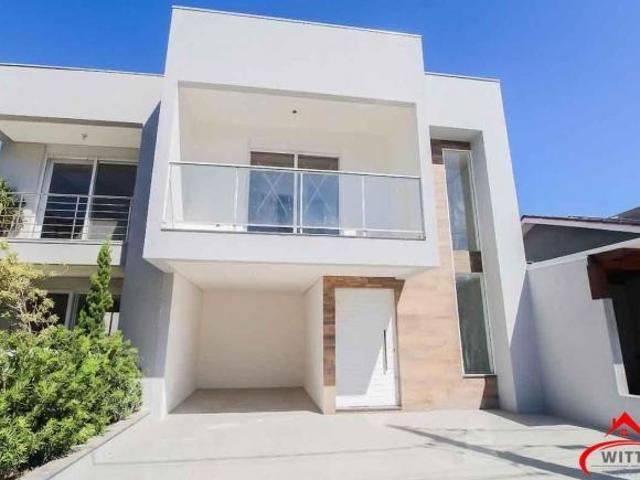 Casa em condomínio 4 D, sendo um dormitório no térreo, 168 m², garagem coberta