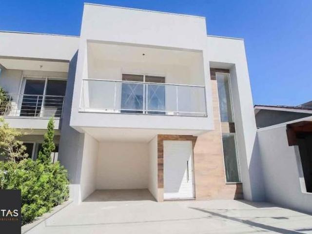 Casa em condomínio 4 D, sendo 1 dormitório, 168 m², garagem coberta