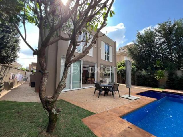 Casa em Condomínio, 4 dormitórios, 325 m², em Condomínio Guaporé 1